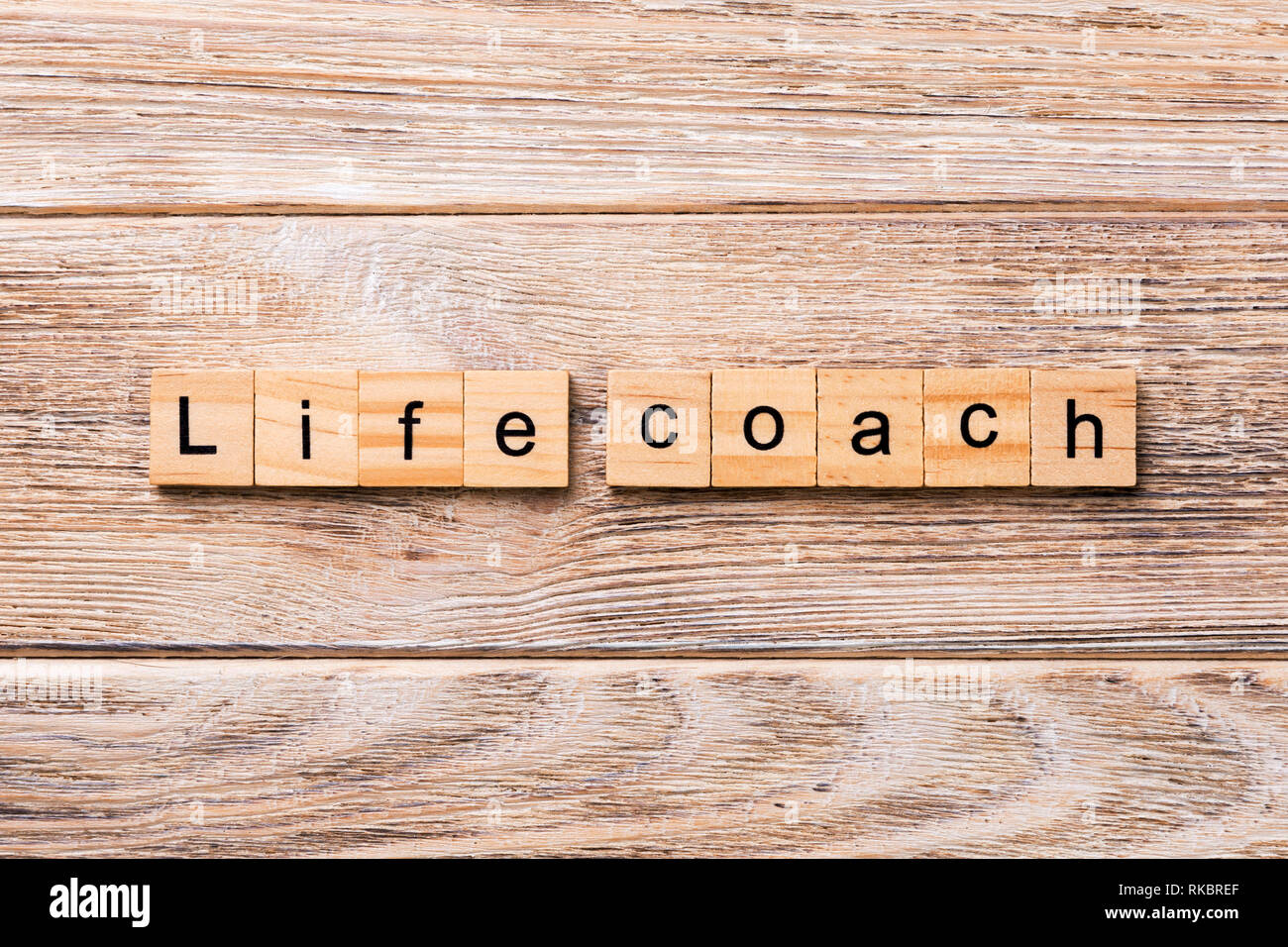 Life coach word written on wood block. Life coach text on wooden table ...
