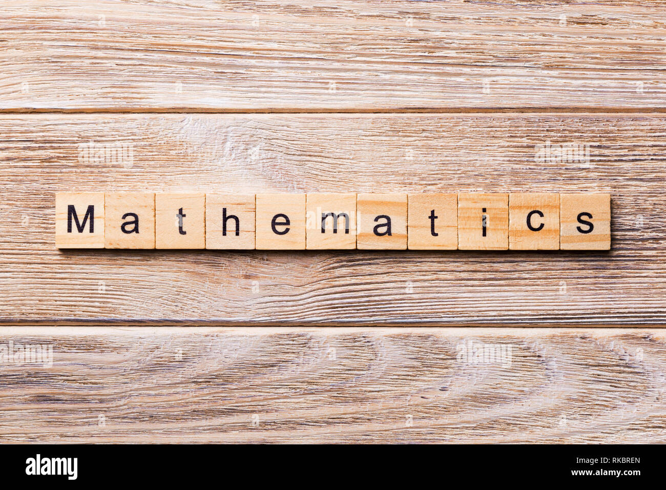 mathematic word written on wood block. mathematic text on wooden table ...