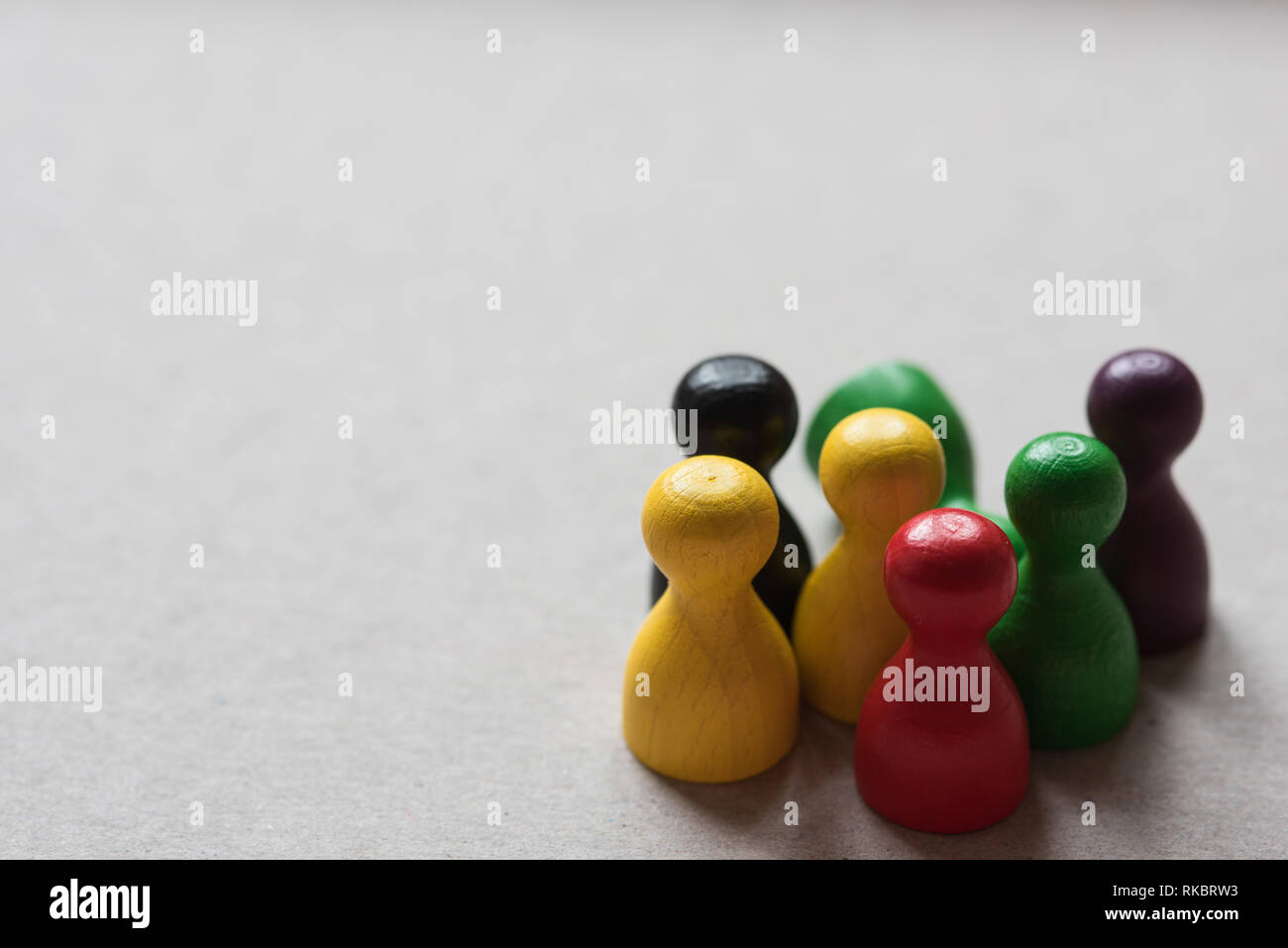 Wooden figures in different colors Stock Photo - Alamy