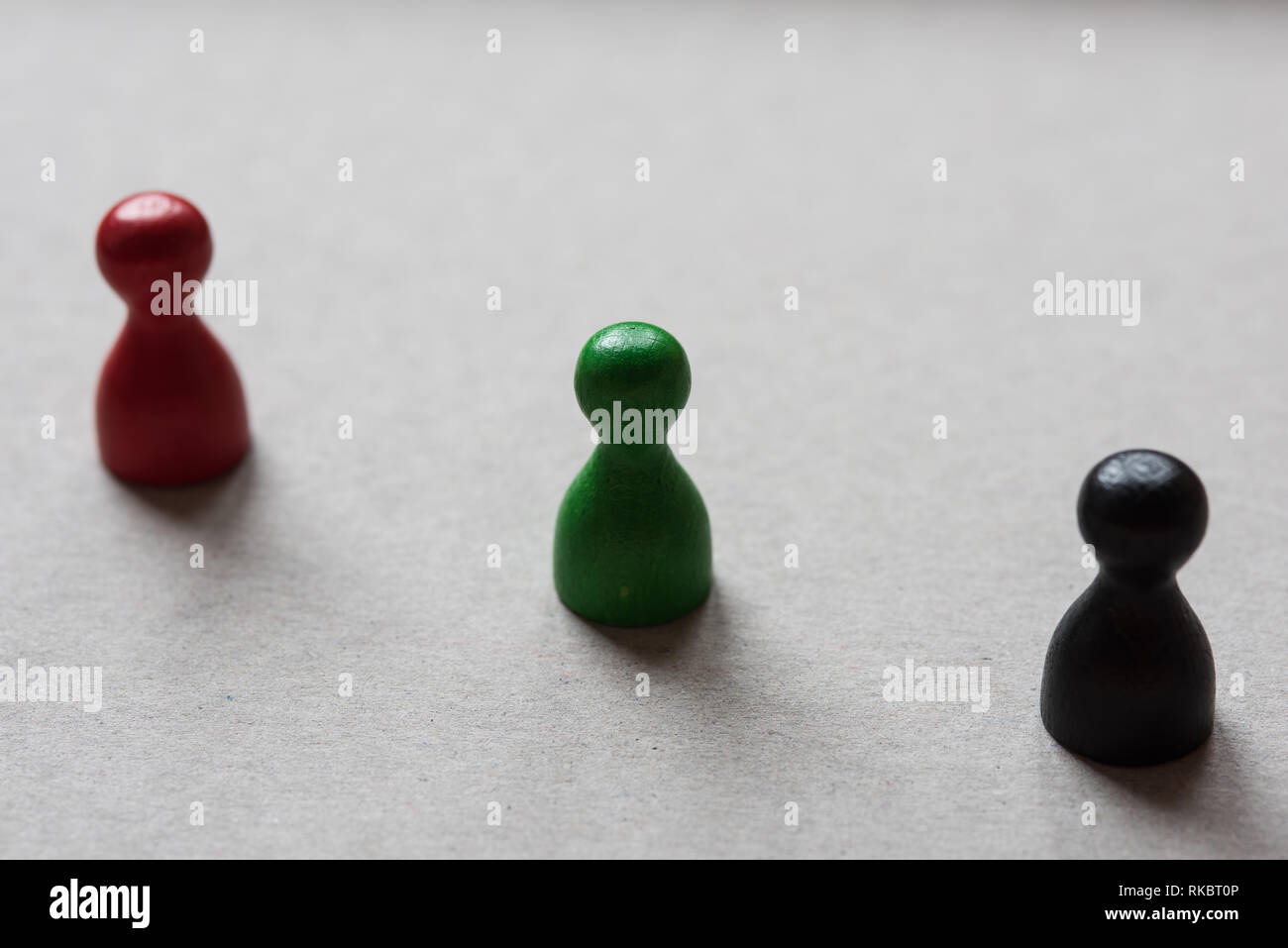 Wooden figures in different colors Stock Photo - Alamy