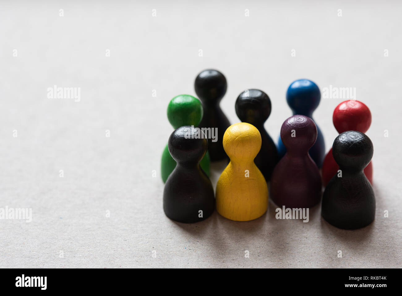 Wooden figures in different colors Stock Photo - Alamy