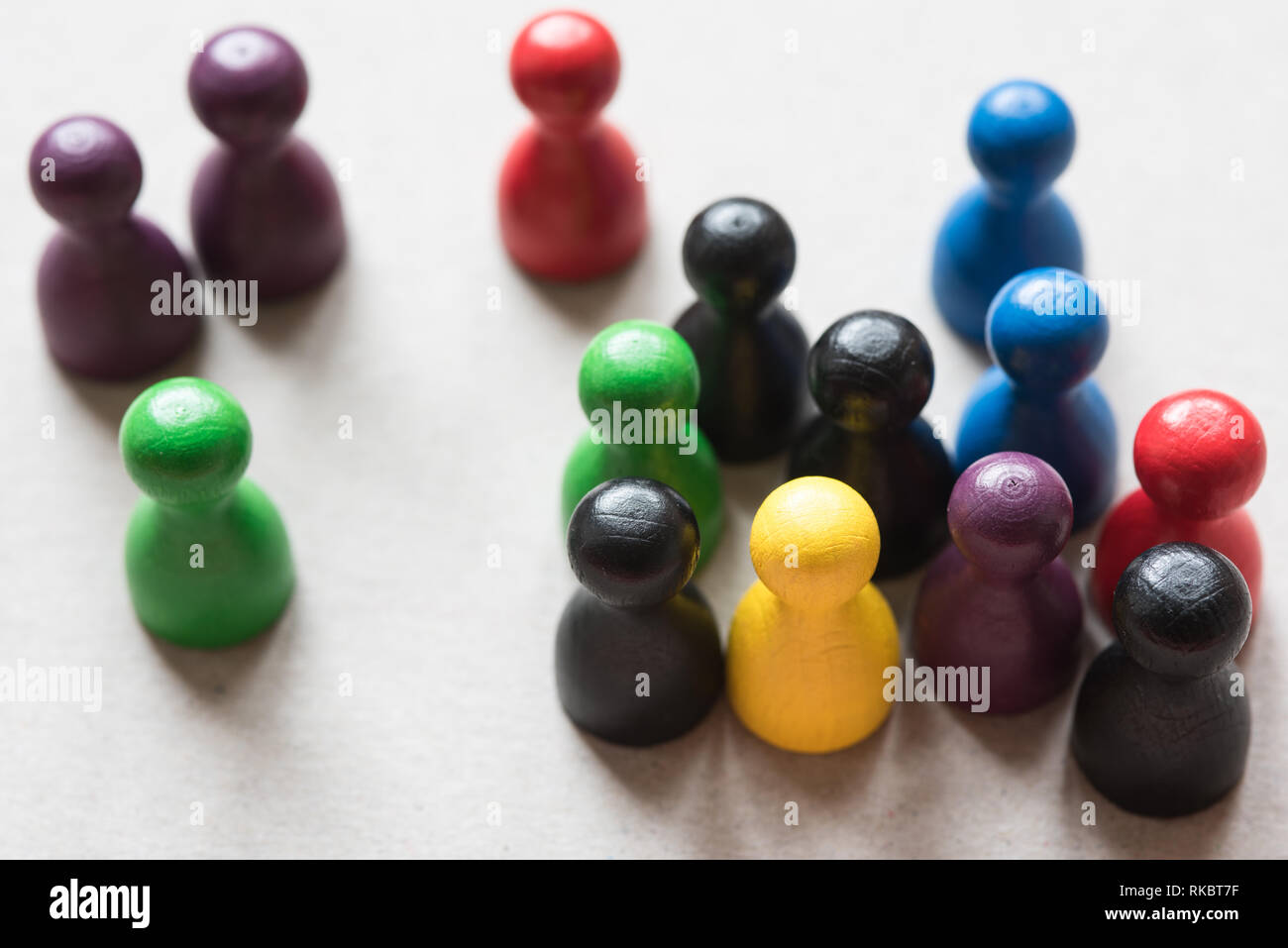 Wooden figures in different colors Stock Photo - Alamy