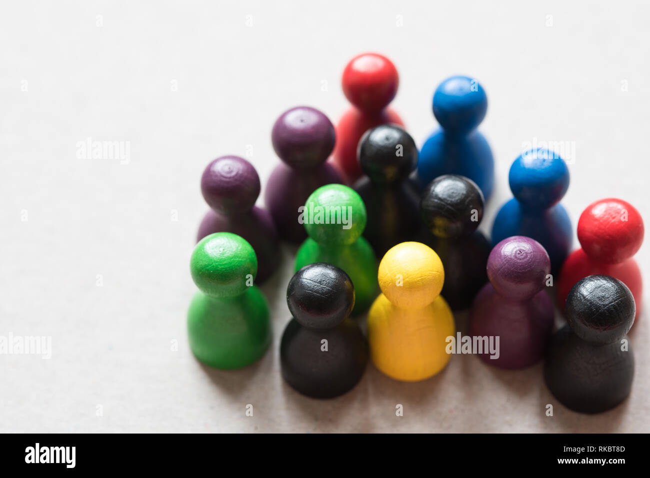 Wooden figures in different colors Stock Photo - Alamy