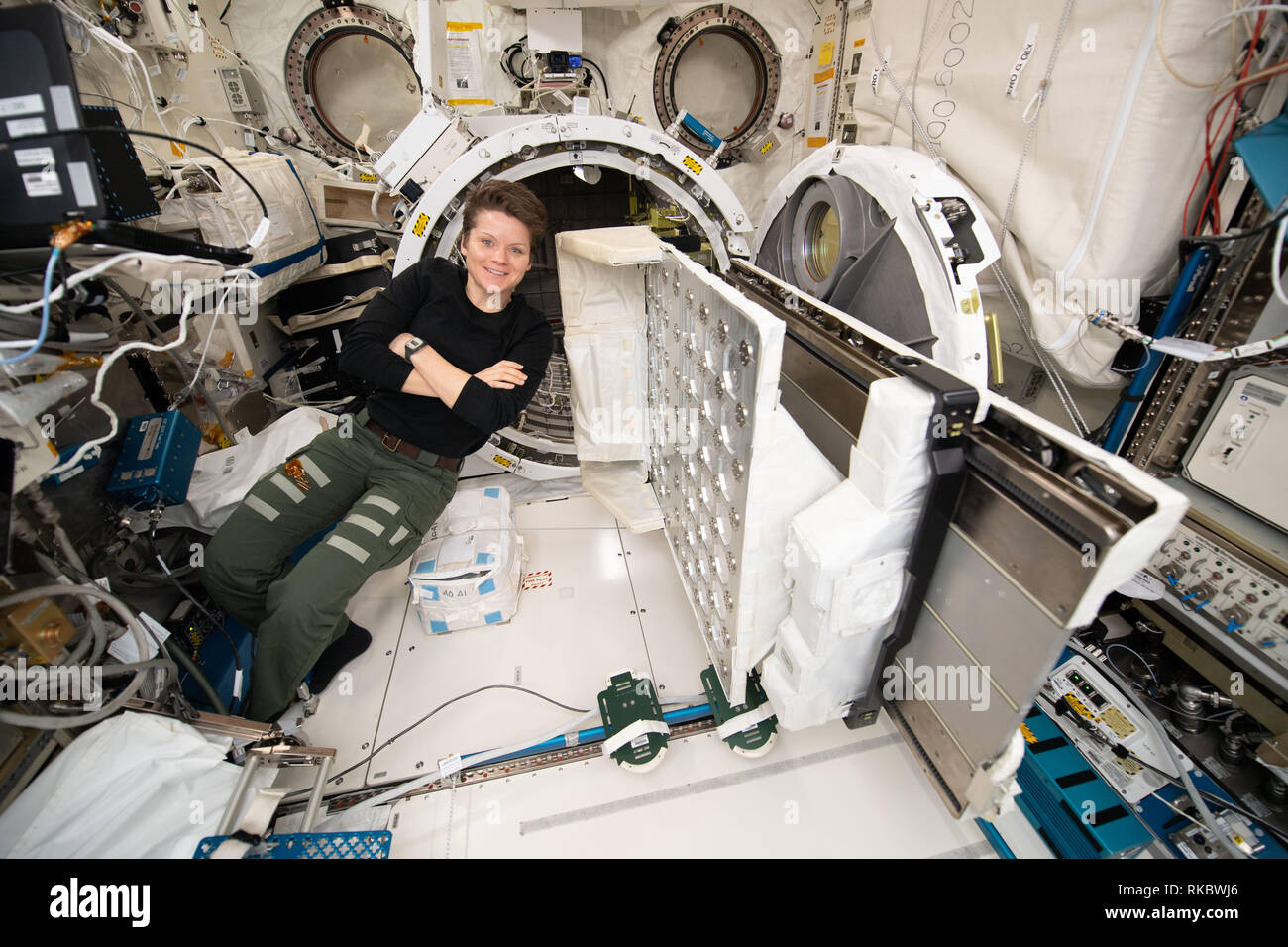 NASA astronaut Anne McClain works inside the Japanese Kibo laboratory ...