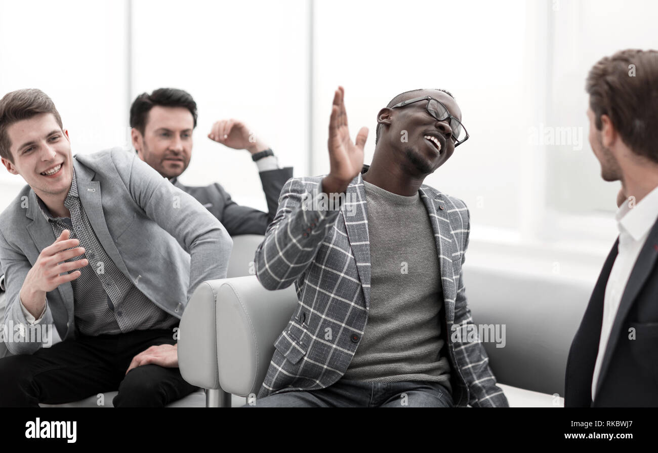 close up.cheerful co-workers giving each other a high five.photo with ...