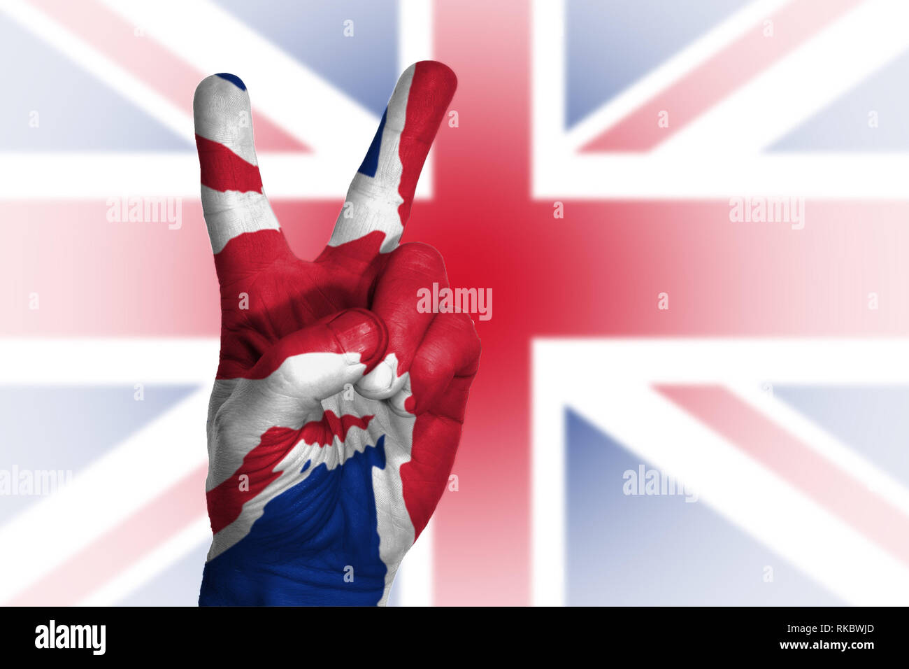Hand making victory sign, united kingdom painted with flag as symbol of ...