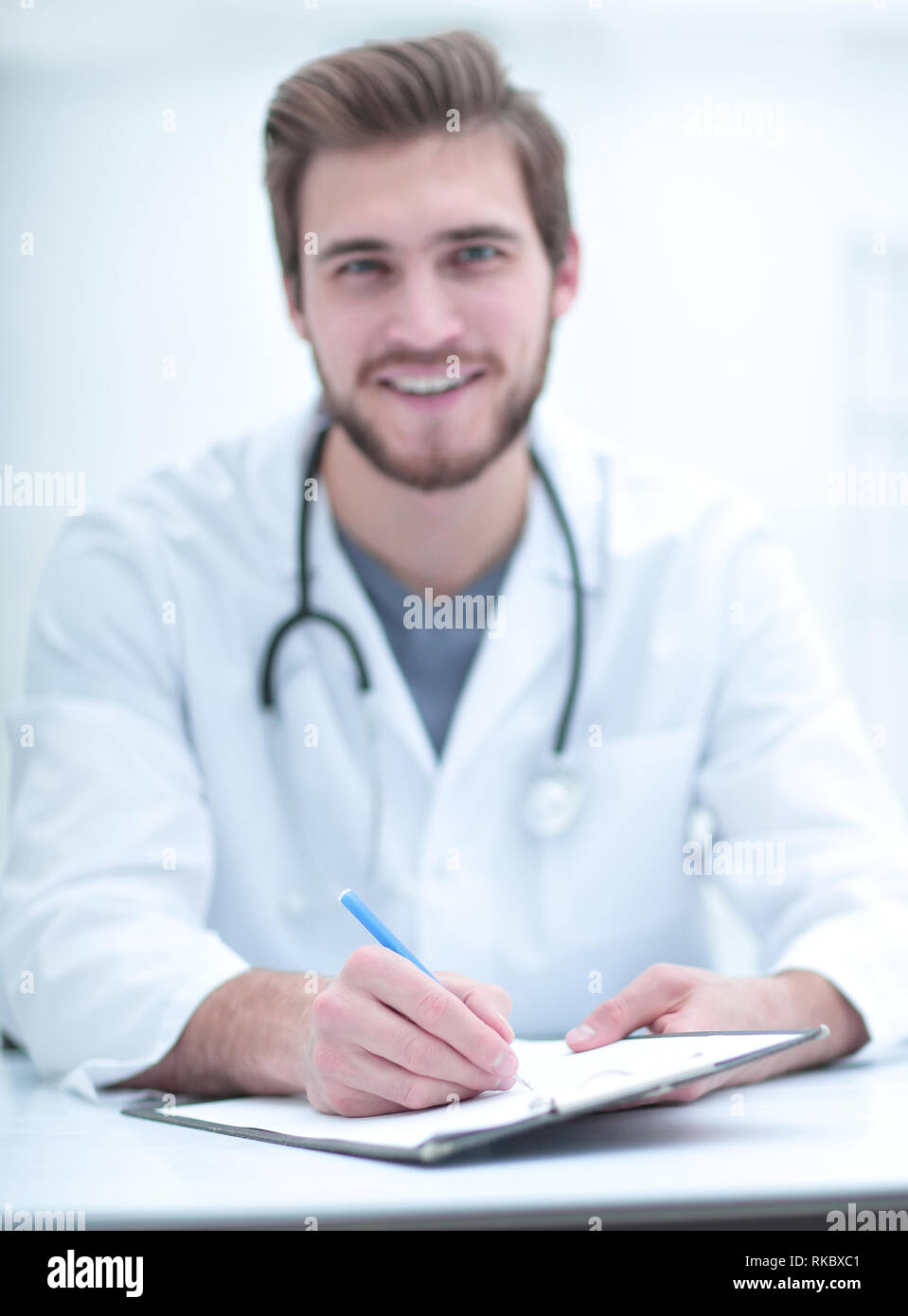 background image of a doctor writing out a prescription.close-up Stock ...