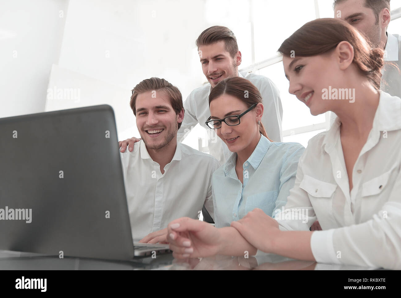 business team looks at the laptop screen. people and technology Stock ...