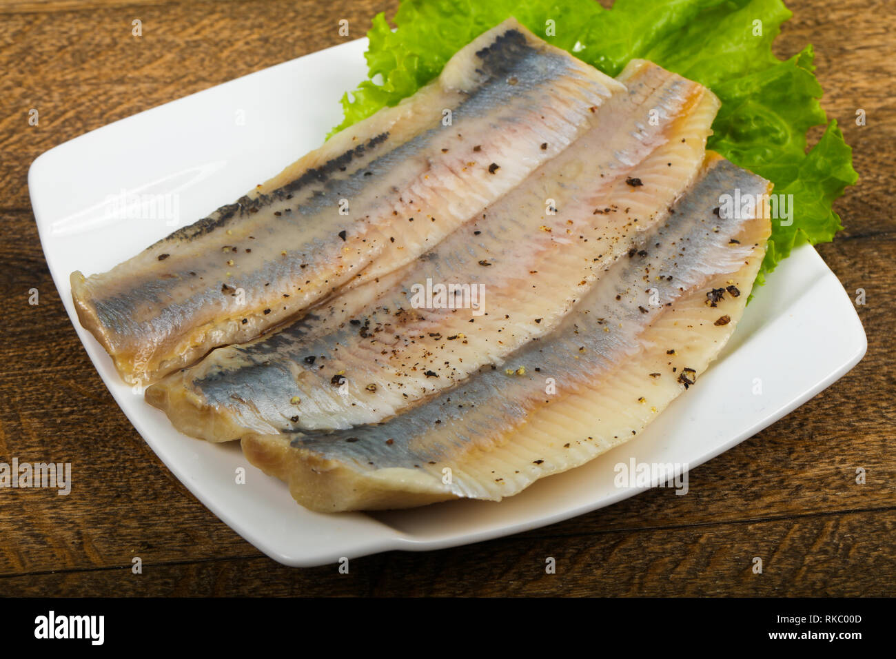 Herring fillet with pepper Stock Photo - Alamy
