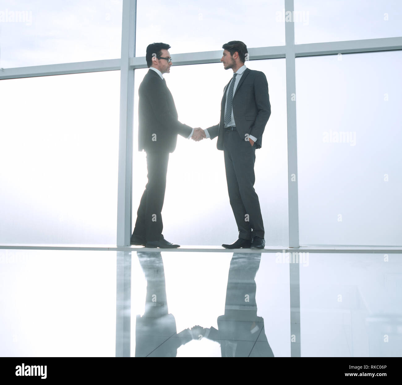 business background.handshake business partners . concept of ...