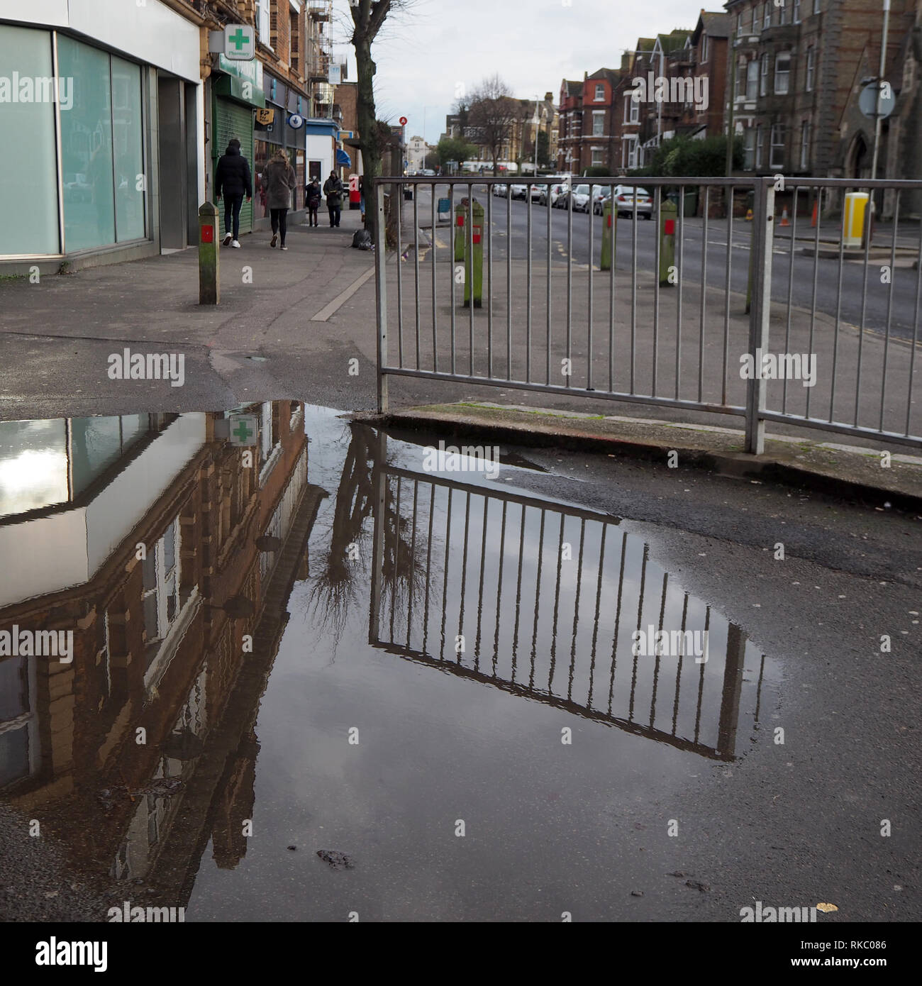 Big puddle on pavement Stock Photo - Alamy