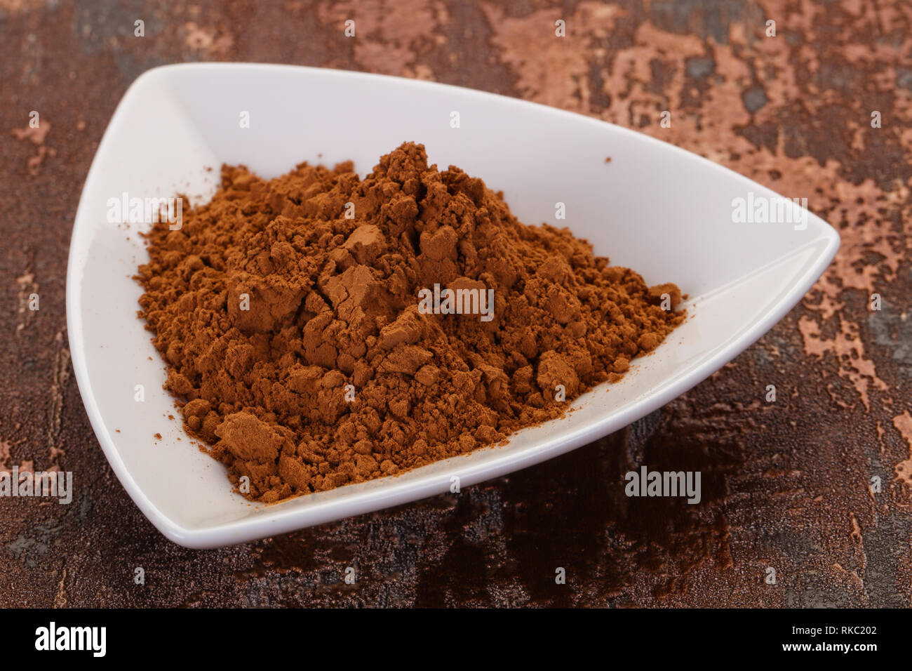 Cocoa powder in the bowl - ready for cooking Stock Photo - Alamy