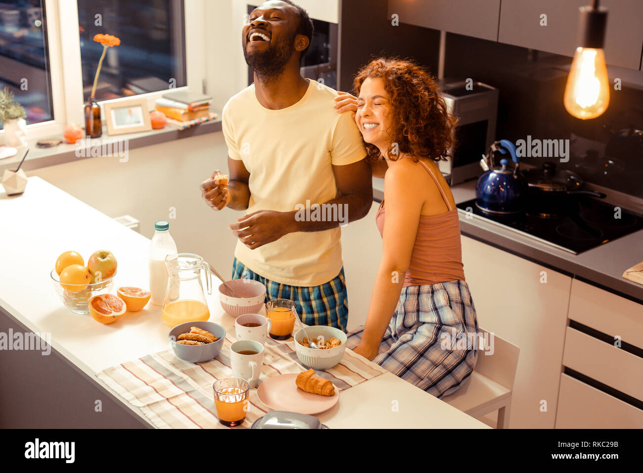 Girlfriend and boyfriend laughing out loud feeling happy together Stock ...