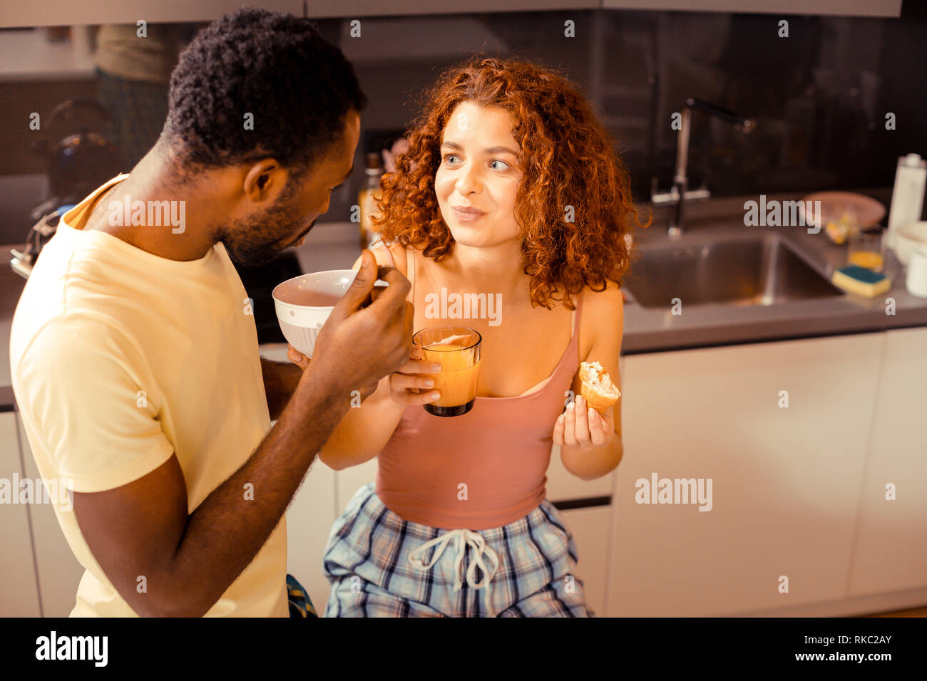 Blue-eyed woman looking at her loving caring boyfriend Stock Photo - Alamy