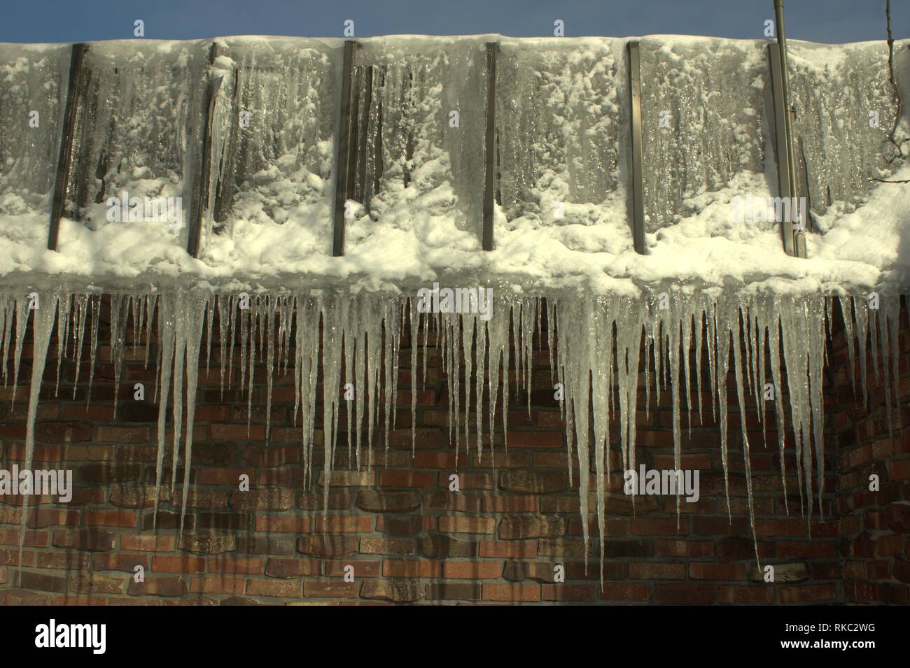 Icicles Dripping Off Of A Brick Building Stock Photo - Alamy