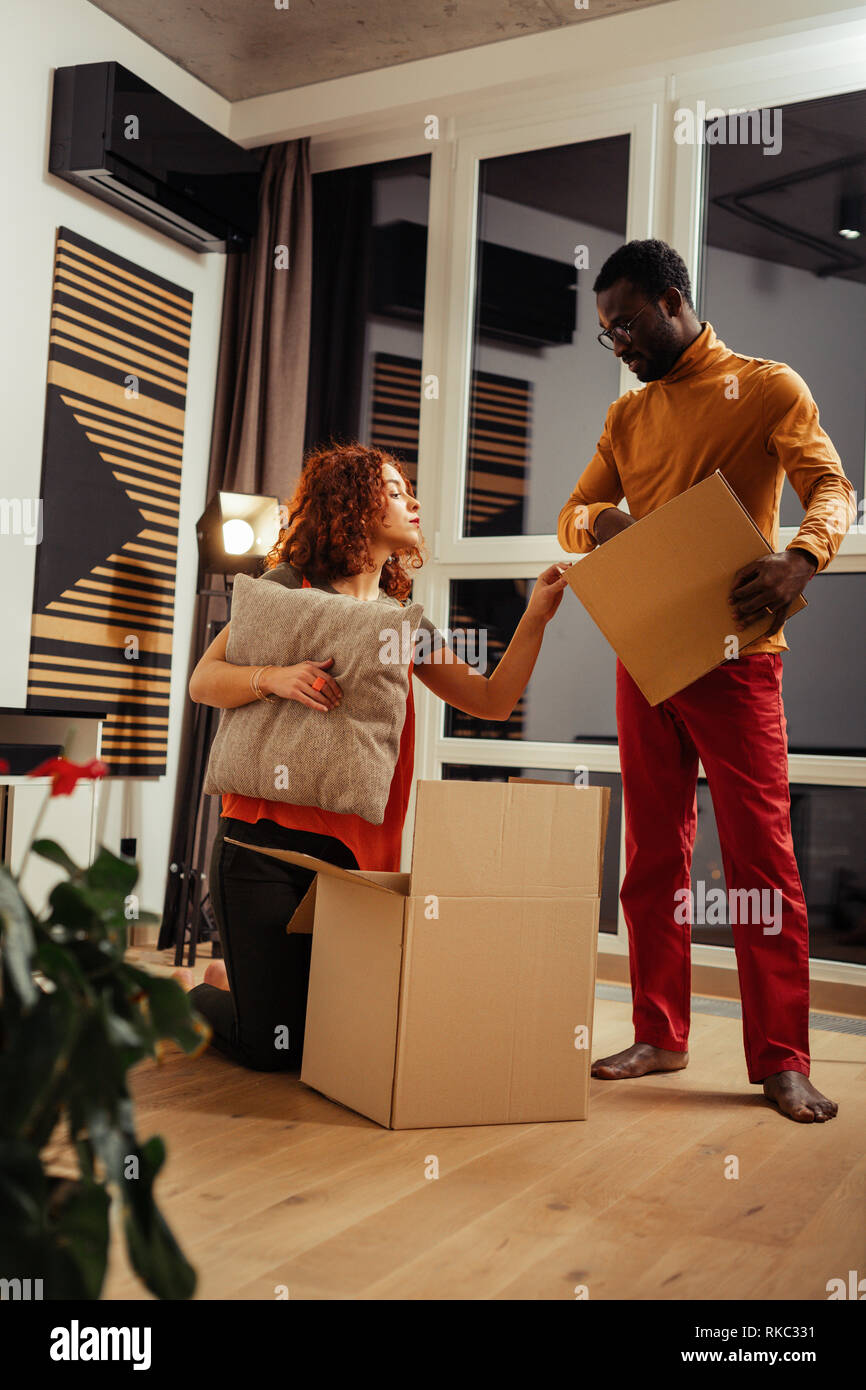 Couple opening big box with presents from their friends Stock Photo - Alamy