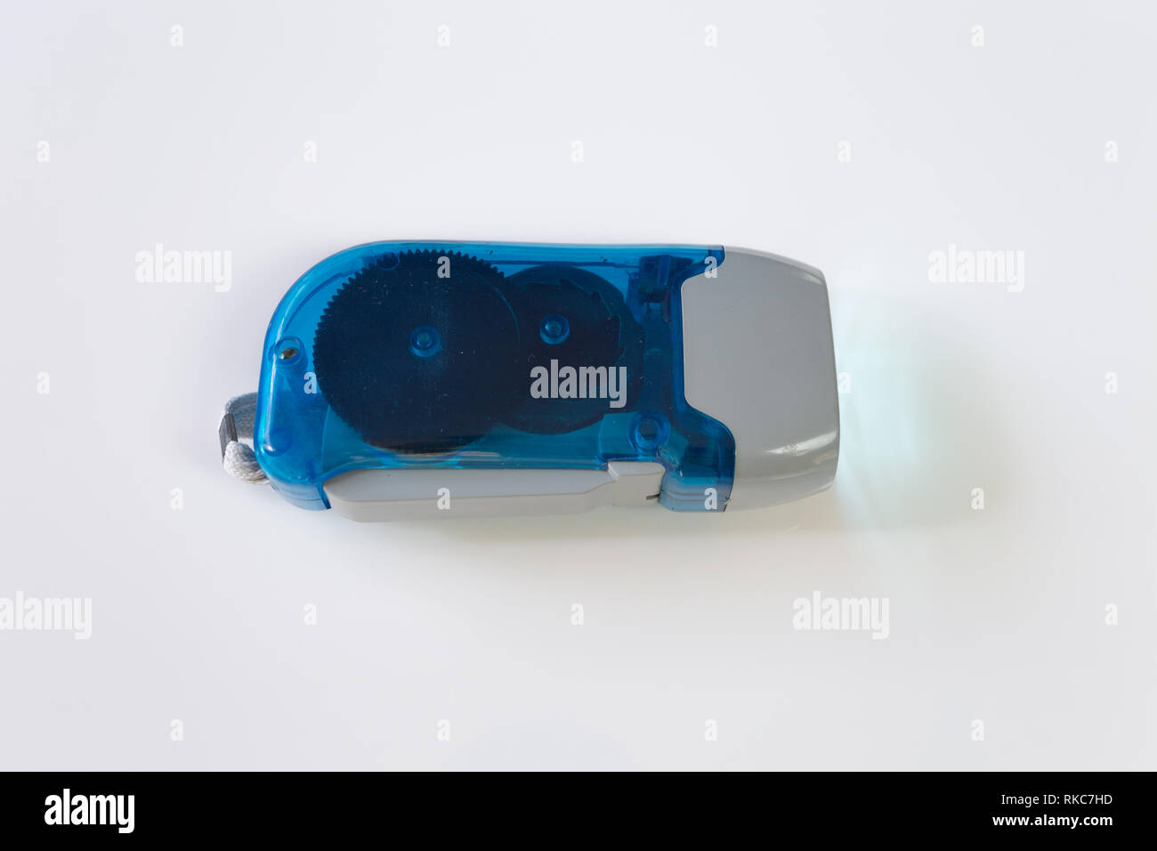 Dyno torch, dynamo wind up flashlight hand pressing crank, squeezing a ...