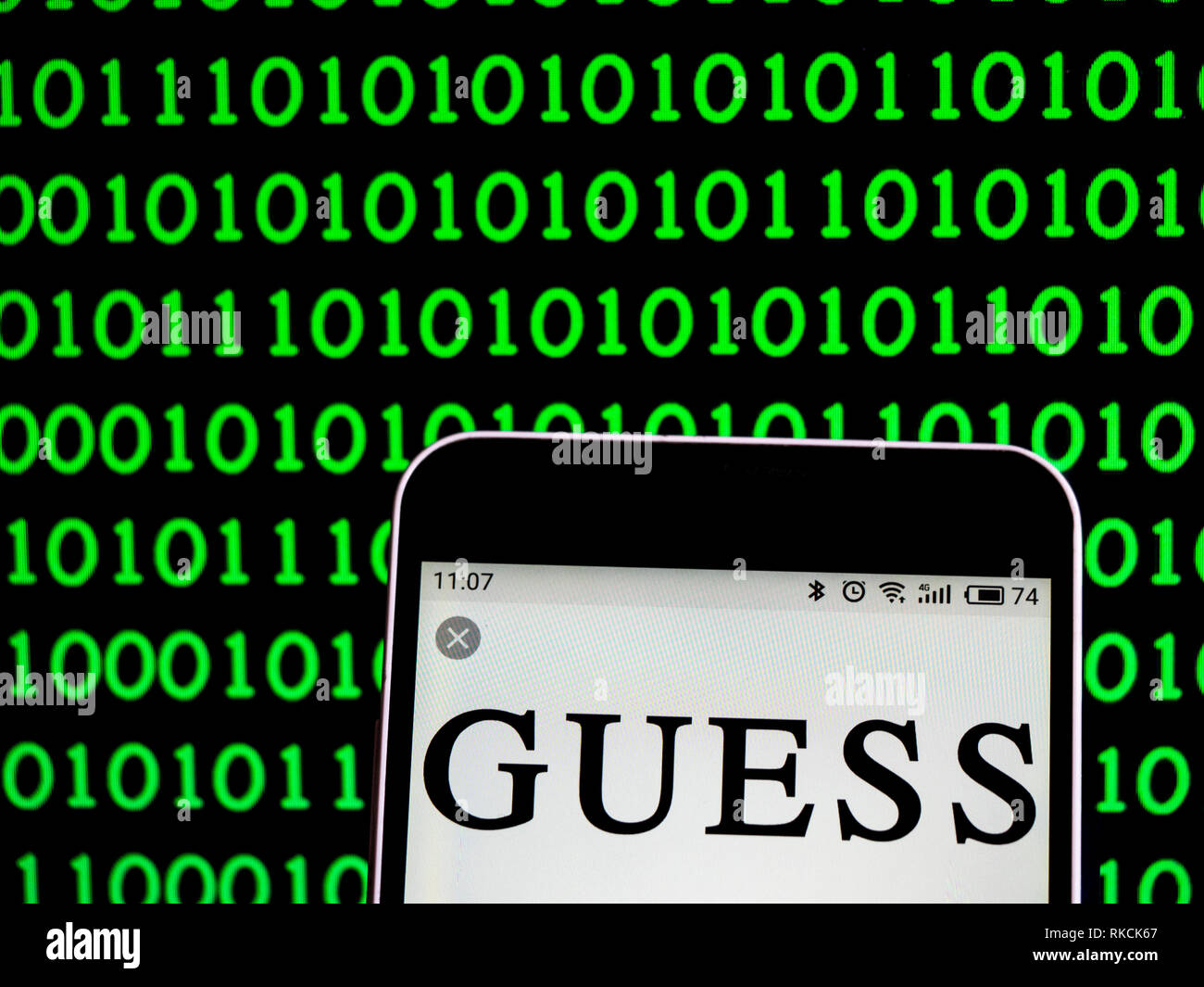 Guess Clothing company logo seen displayed on a smart phone Stock Photo ...