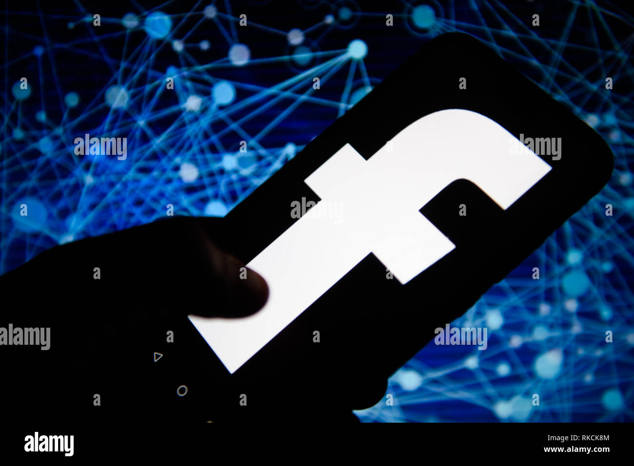 Black facebook logo is seen on an android mobile phone Stock Photo - Alamy