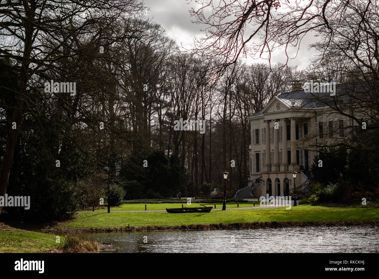 A mansion seen in the middle of the forest during stormy weather Stock ...