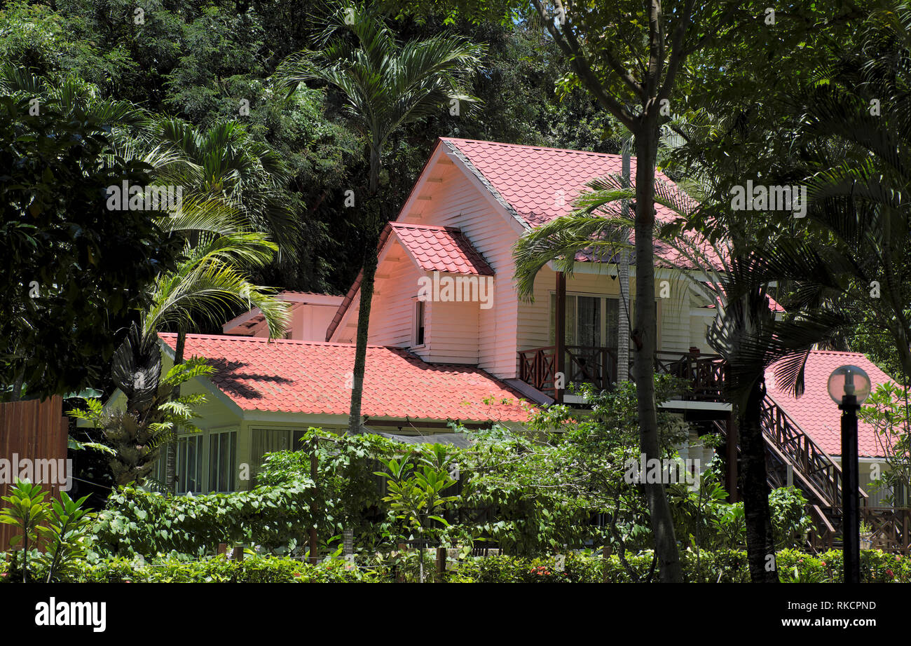 bright pink house in the rainforest,borneo Stock Photo - Alamy