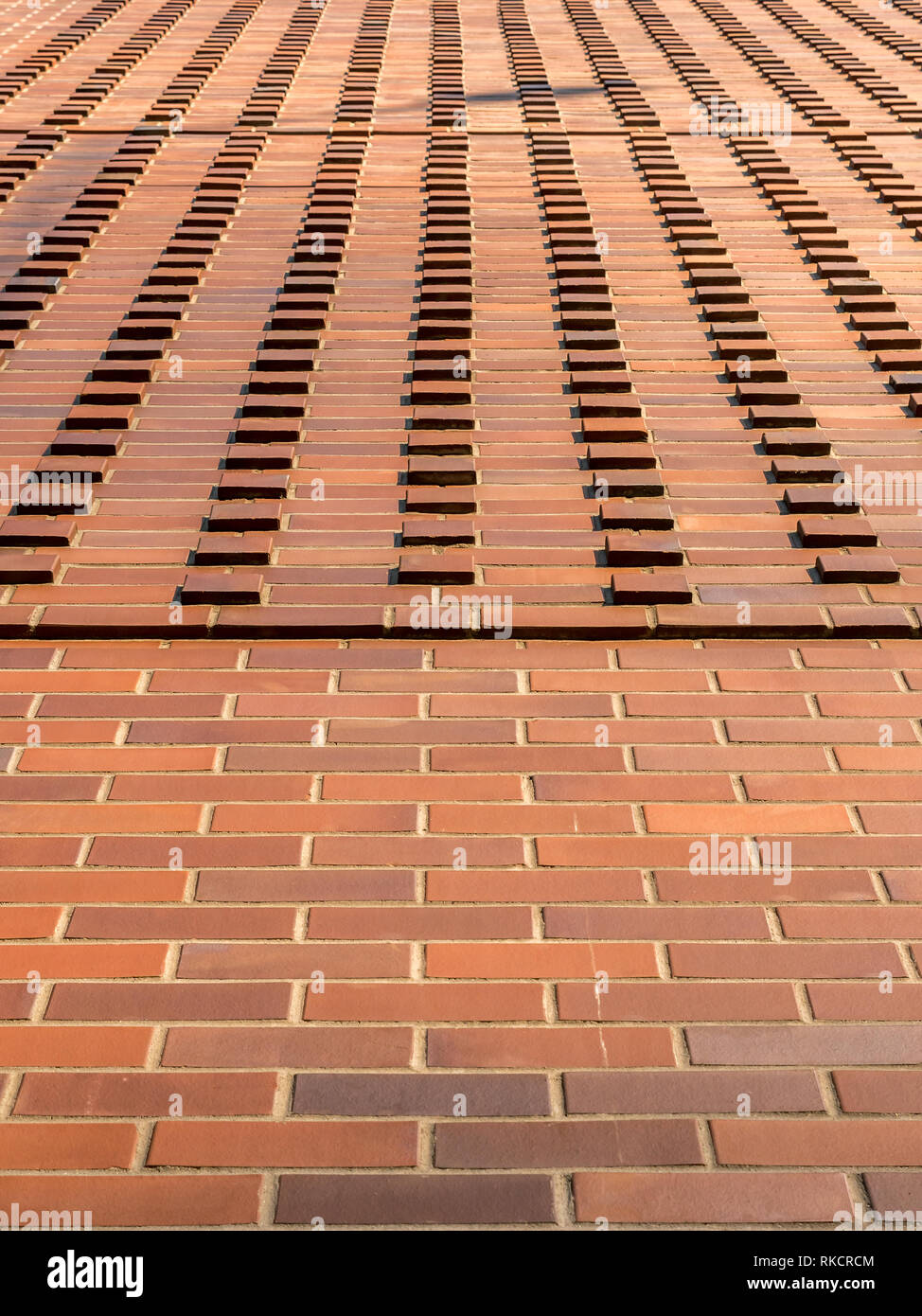 Background of red brick wall - converging perspective Stock Photo - Alamy