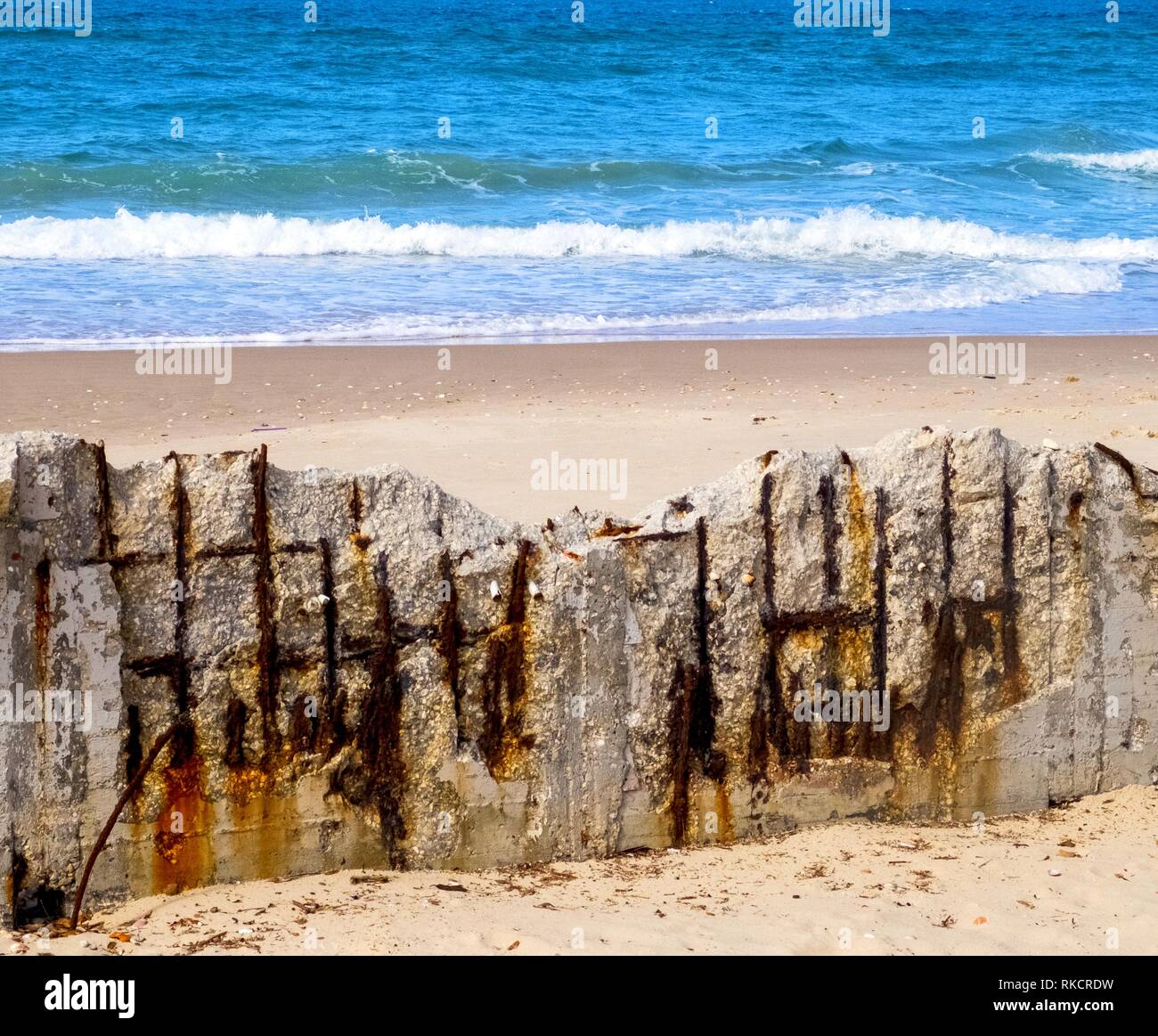 Reinforced concrete structure on the beach, collapsing from moisture ...