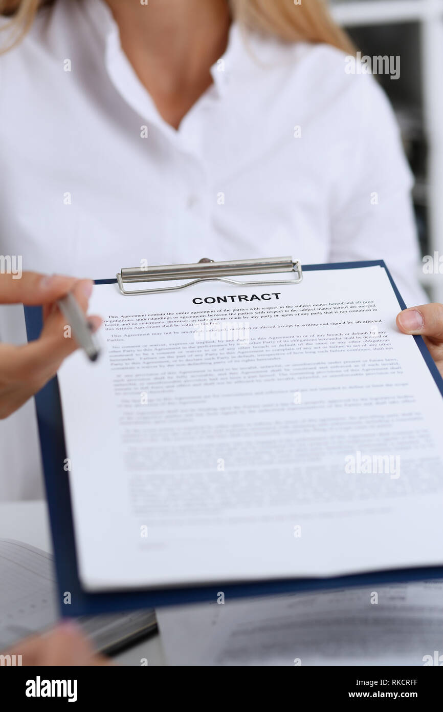 Female arm in white shirt offer contract form Stock Photo - Alamy