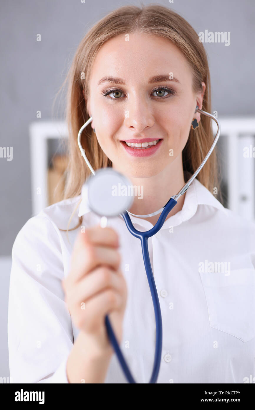 Beautiful smiling female doctor hold in hand stethoscope head Stock ...