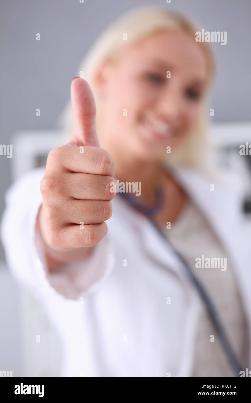 Beautiful smiling female doctor showing OK or confirm sign Stock Photo ...