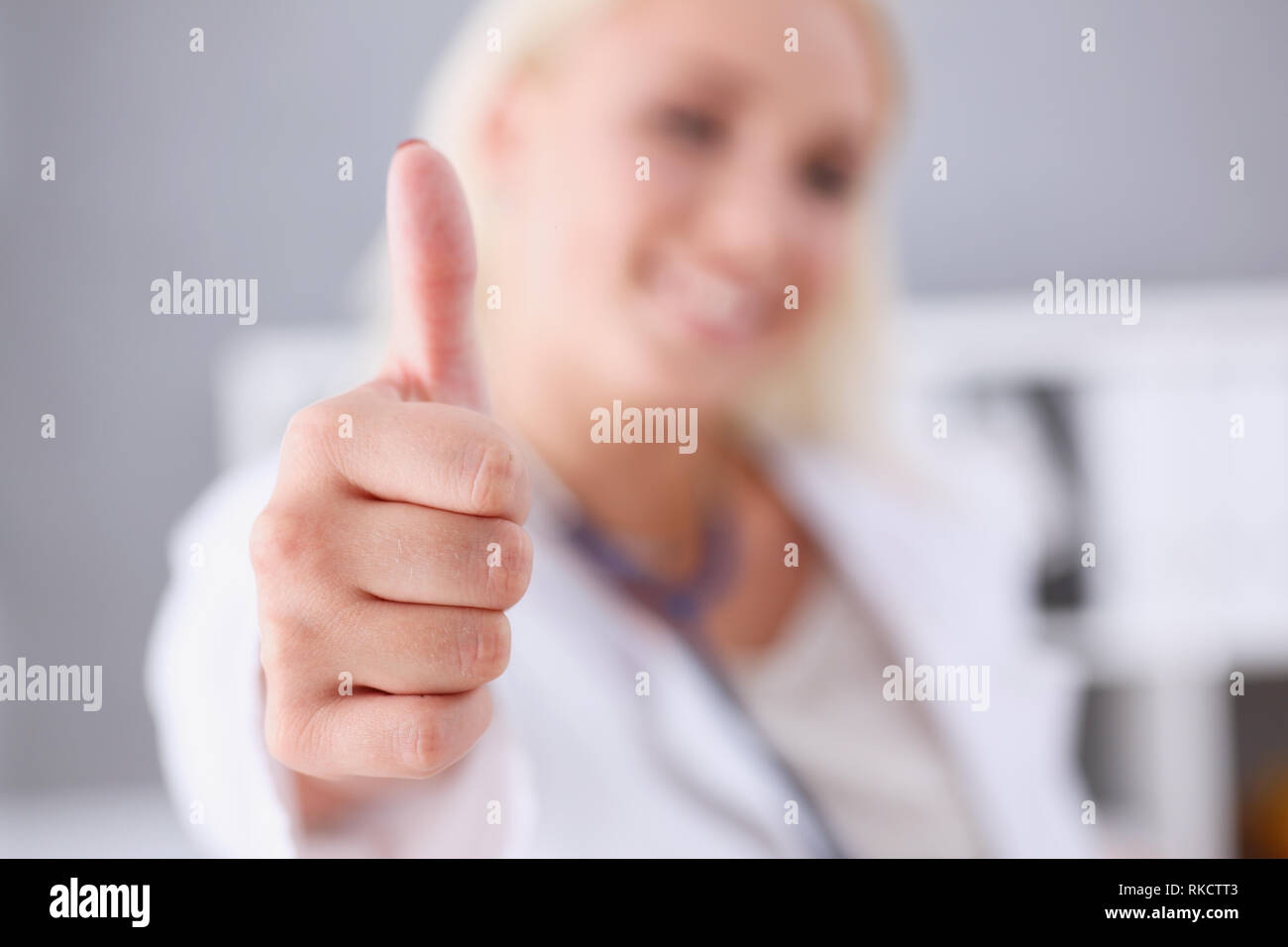 Beautiful smiling female doctor showing OK or confirm sign Stock Photo ...