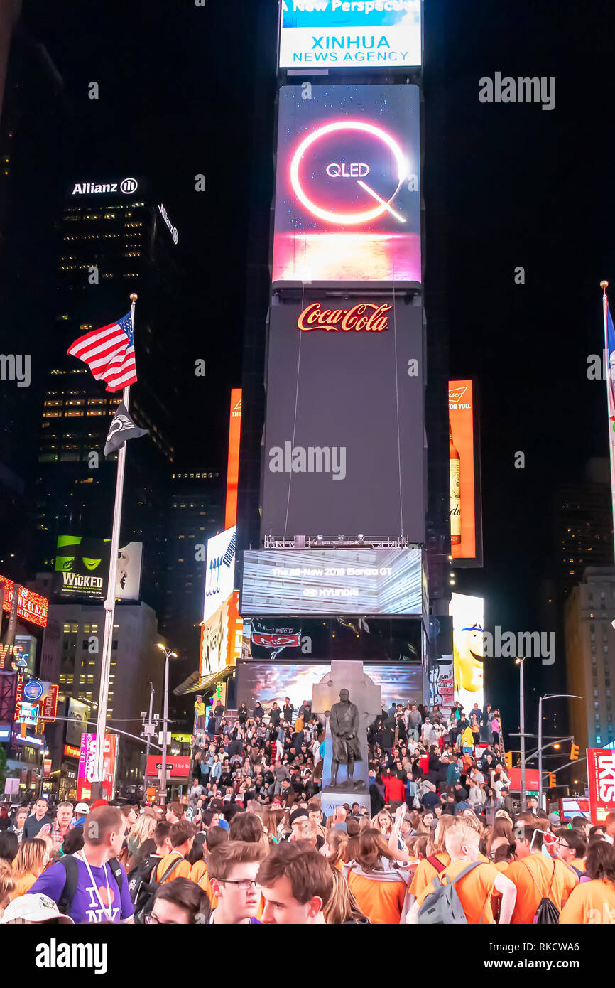 People activity in Times Square at night. Times Square is a busy ...