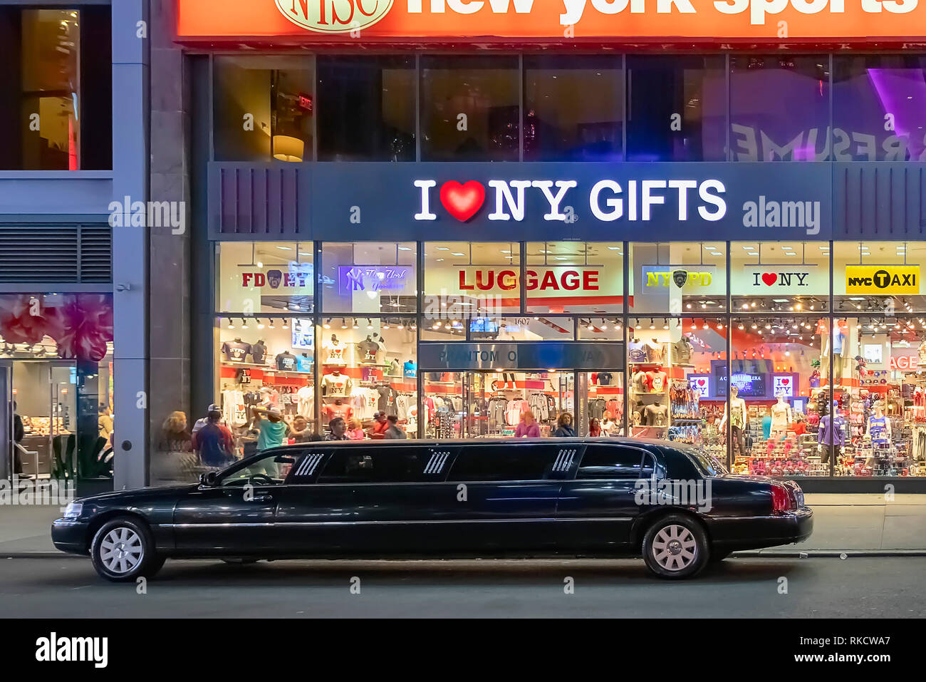 Luxury black limousine on Times Square at night Stock Photo - Alamy