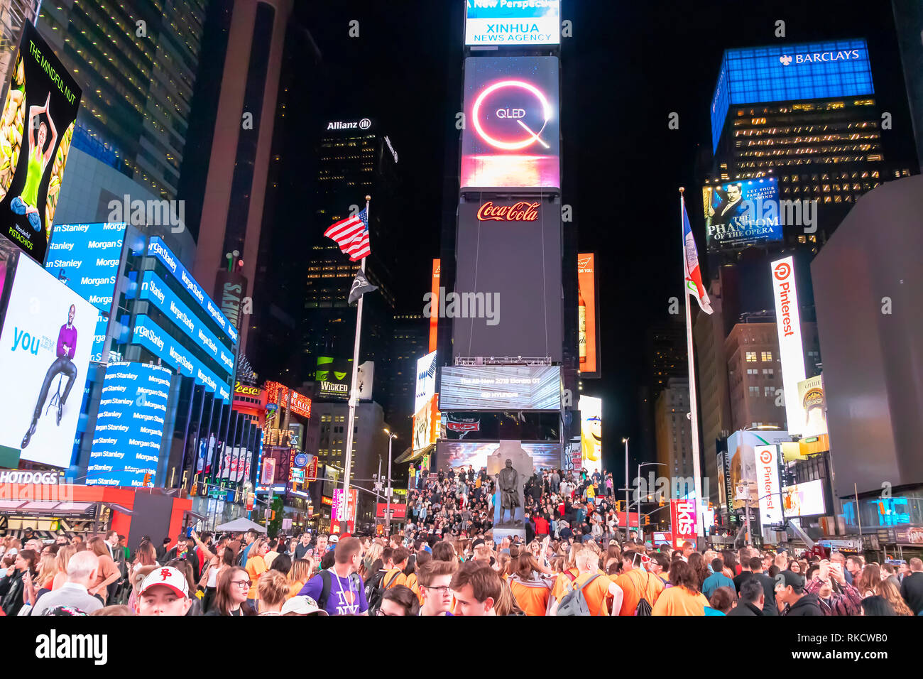 People activity in Times Square at night. Times Square is a busy ...