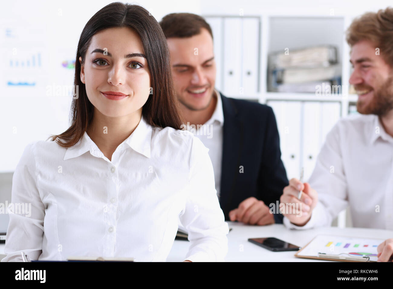 Beautiful smiling cheerful girl at workplace Stock Photo - Alamy