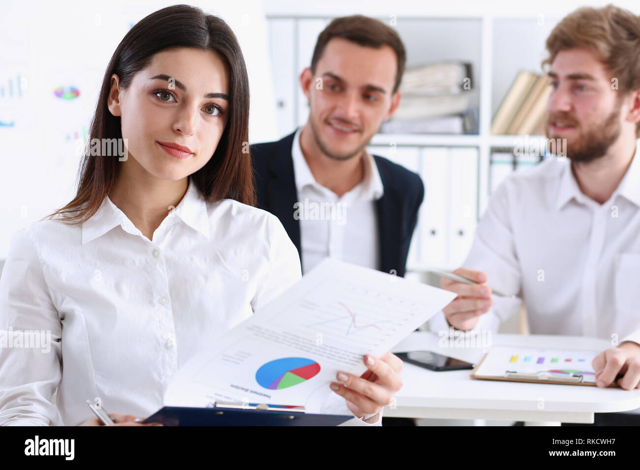 Beautiful smiling cheerful girl at workplace Stock Photo - Alamy