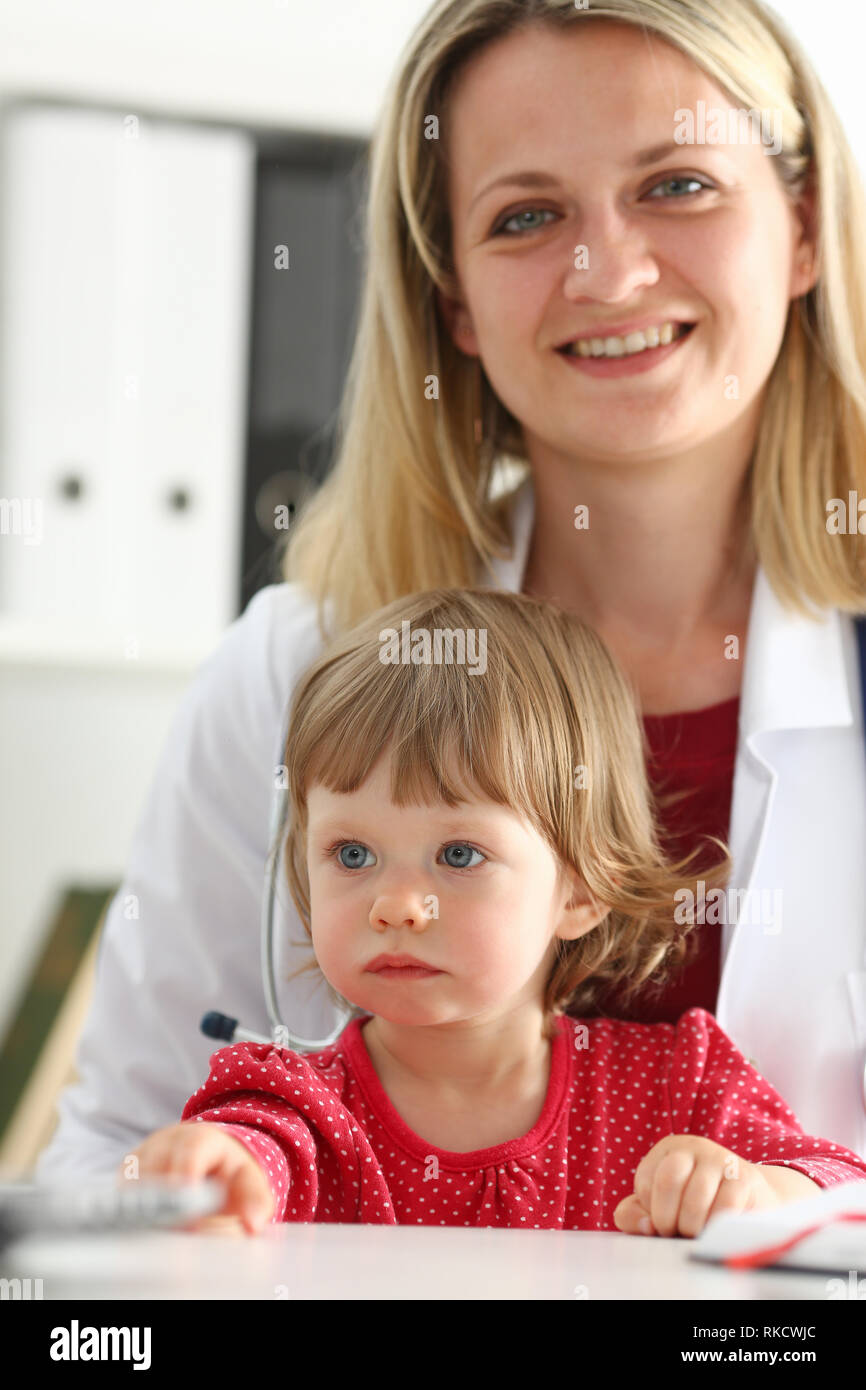 Little child at pediatrician reception Stock Photo - Alamy