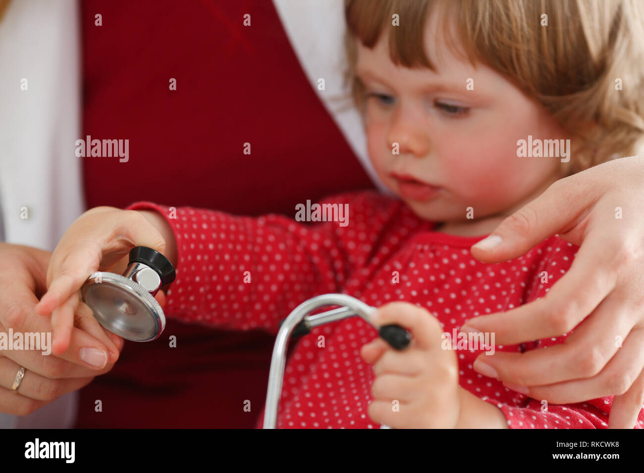 Little child with stethoscope at doctor Stock Photo - Alamy