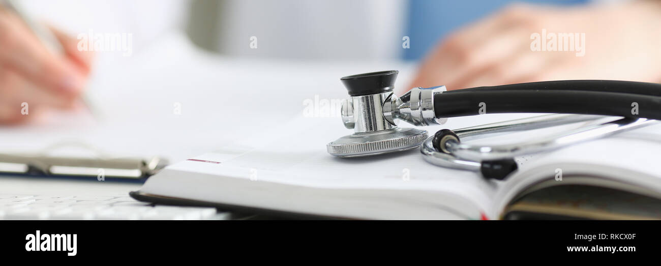 Stethoscope head lying on medical forms Stock Photo - Alamy
