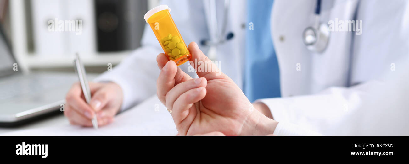 Female medicine doctor write prescription Stock Photo - Alamy