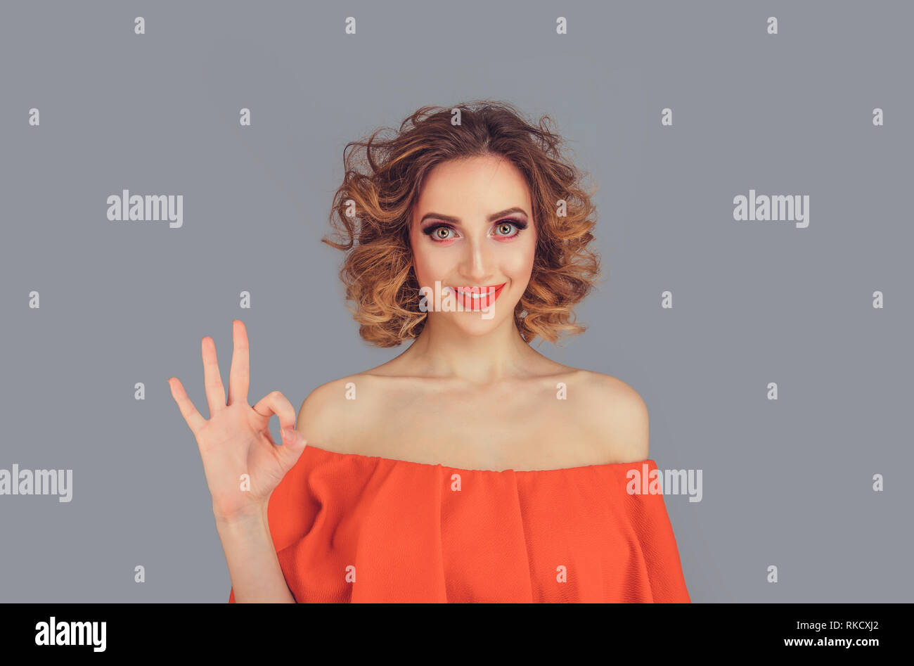 Woman giving okay sign hi-res stock photography and images - Alamy
