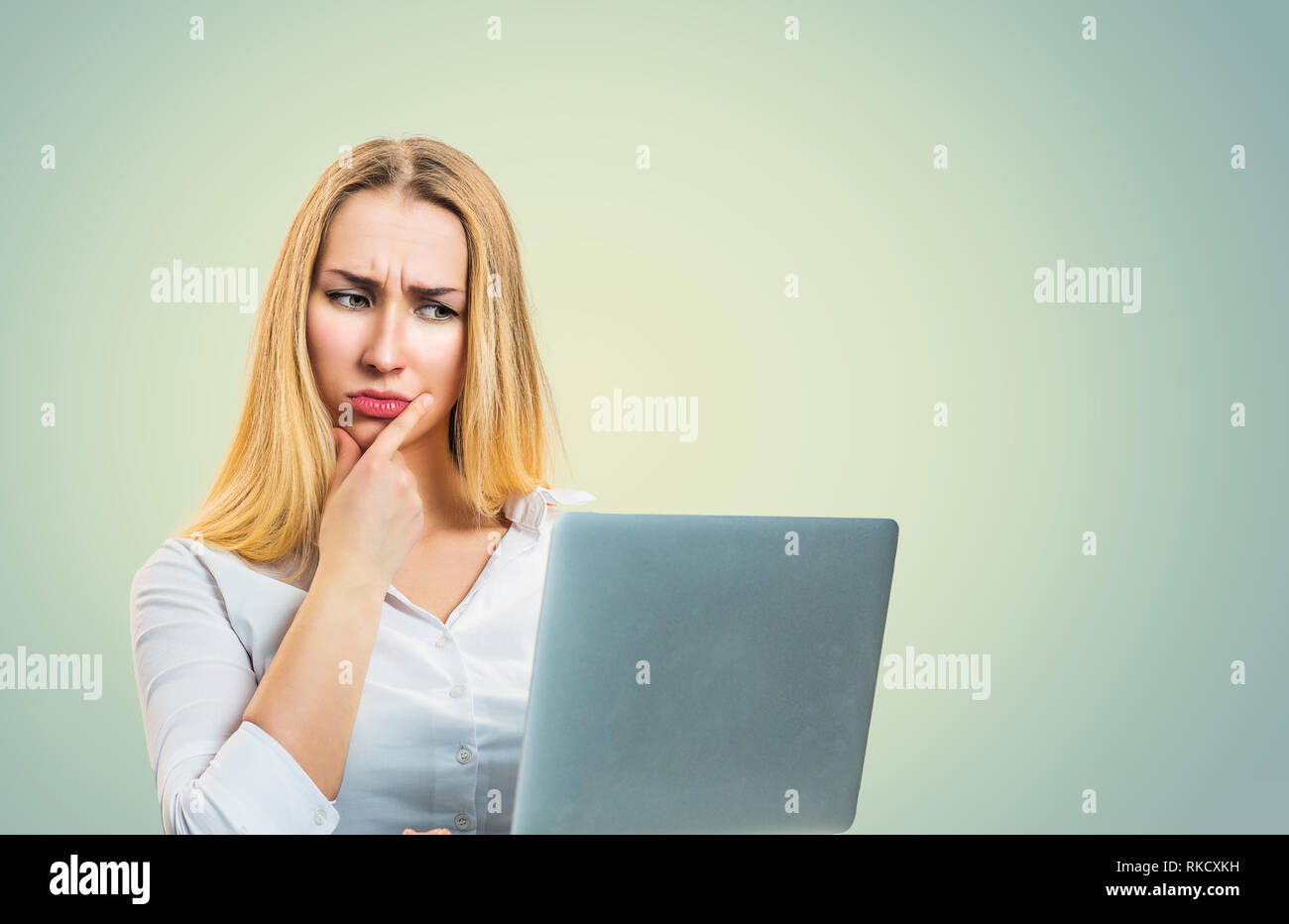 Woman suspicious laptop hi-res stock photography and images - Alamy