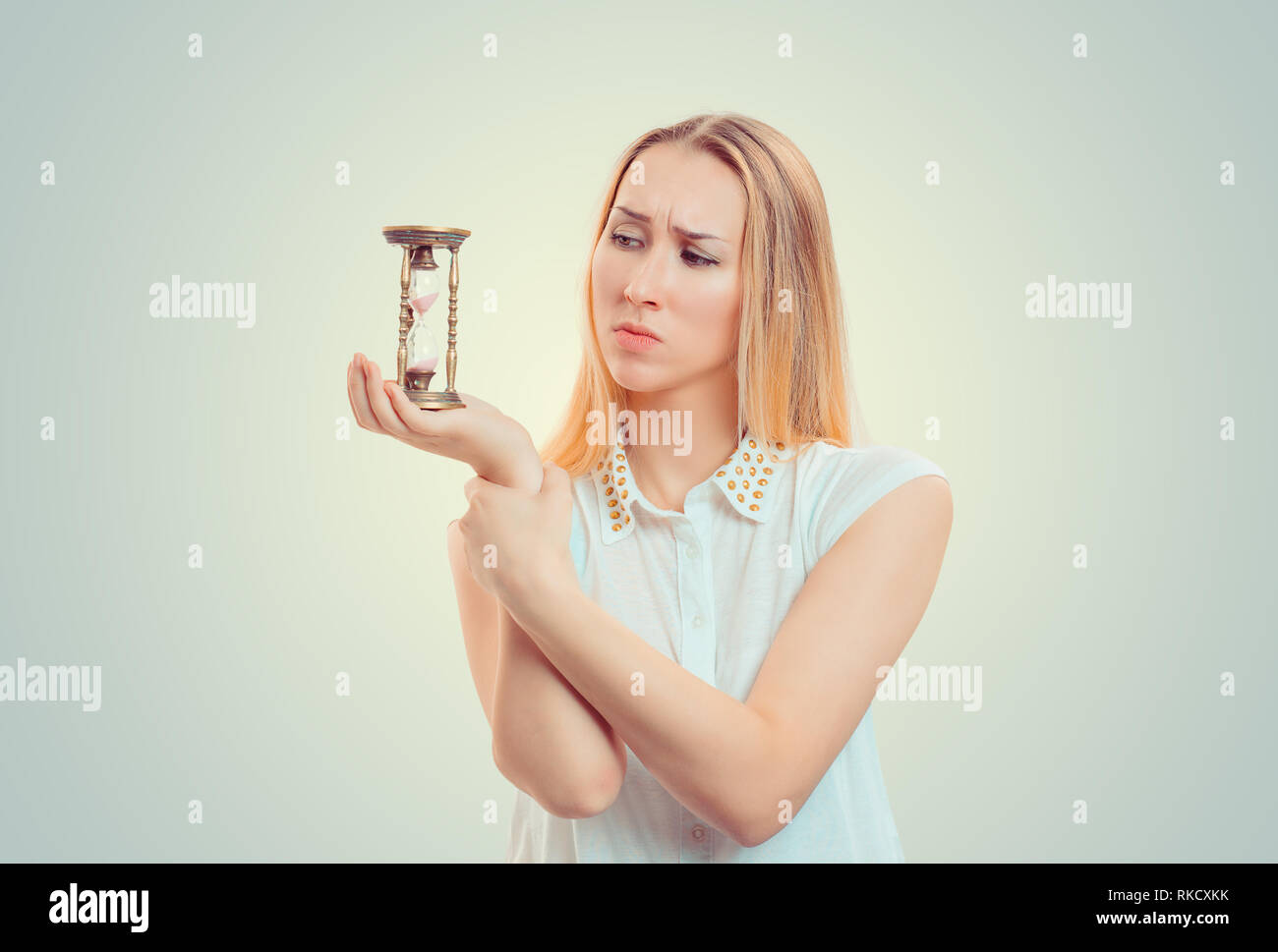 Woman hourglass time sad hi-res stock photography and images - Alamy