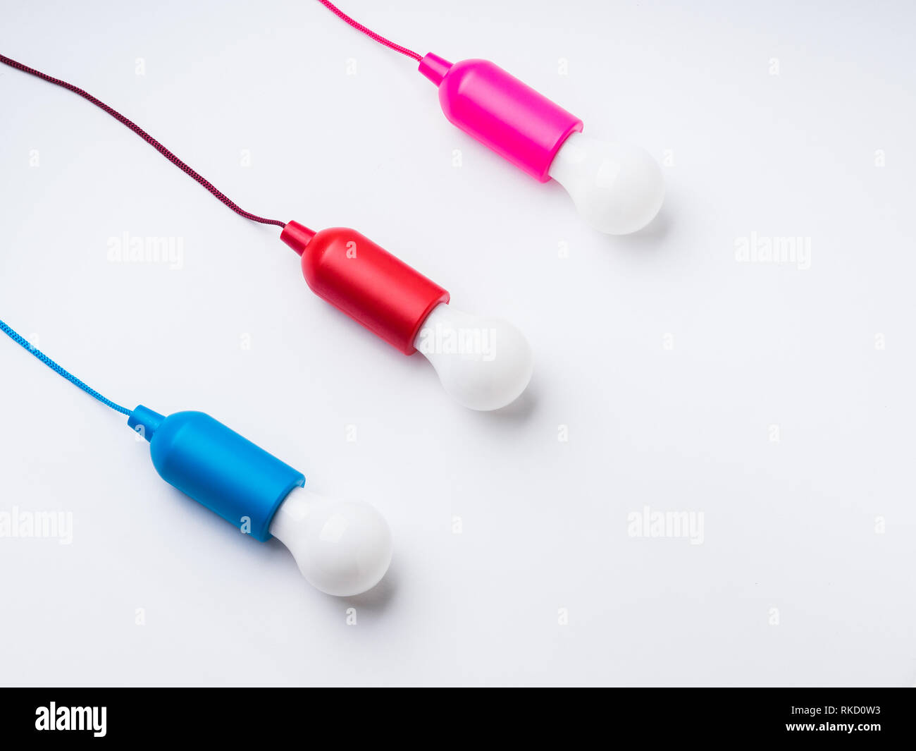 Three color light bulb lamps on white. Concept Stock Photo - Alamy