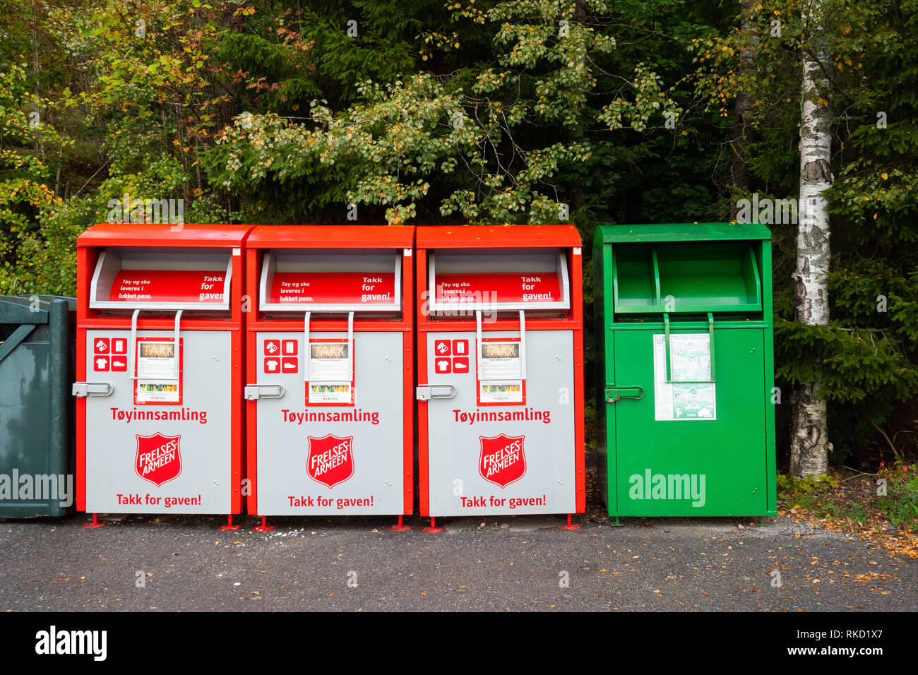 Four recycling bins for second hand clothes in Norway Stock Photo - Alamy