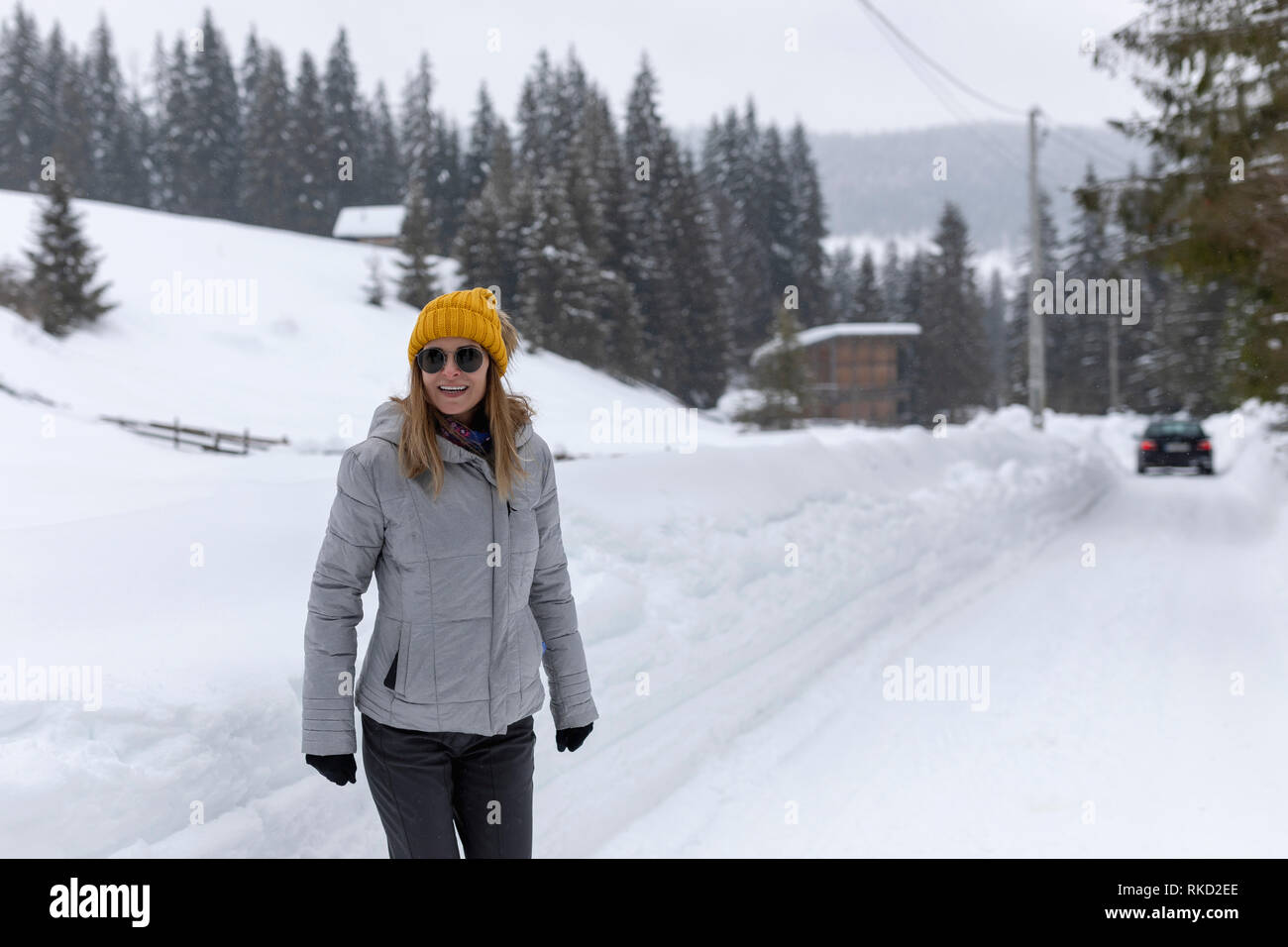 Hapopy tourist lady in her winter holiday in the mountains Stock Photo ...
