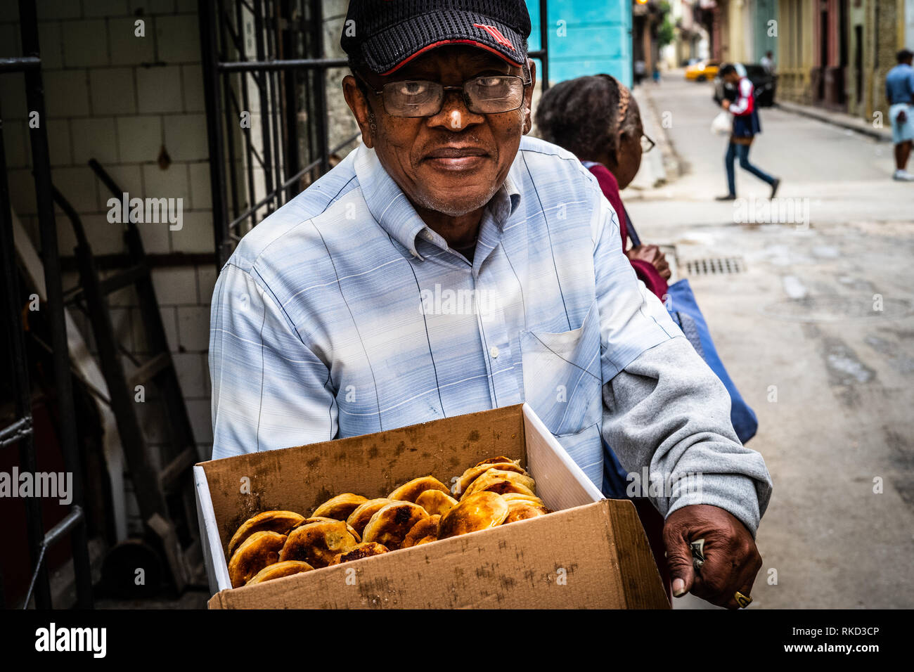 Salesman selling freshly baked biscuits on the street of Havana Stock ...