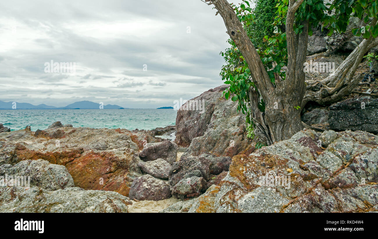 Rocks and ocean at beach in Thailand, Koh Thalo Tropical island ...
