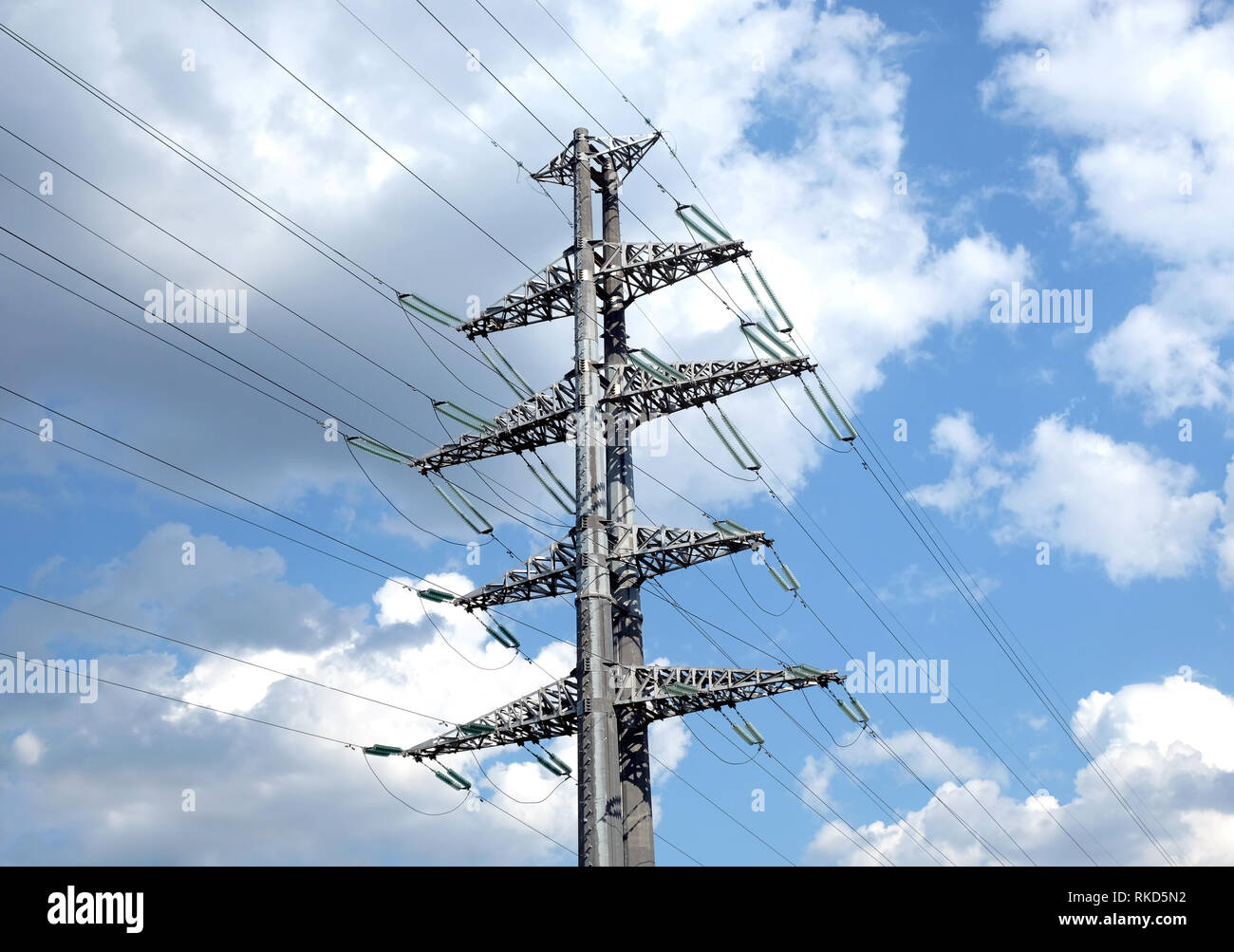 High-voltage power line gray metal prop with many wires closeup view ...