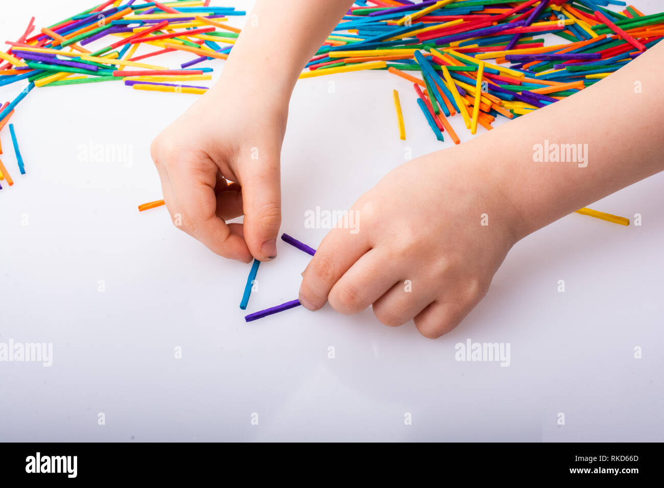 Kid making triangle shape on as creative concept Stock Photo - Alamy